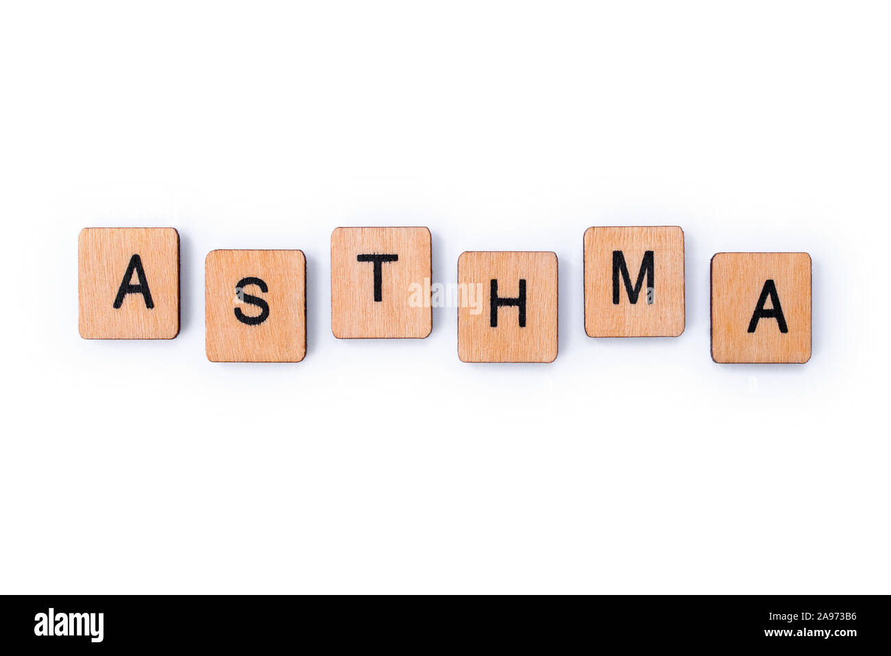 The word ASTHMA, spelt with wooden letter tiles over a white background ...
