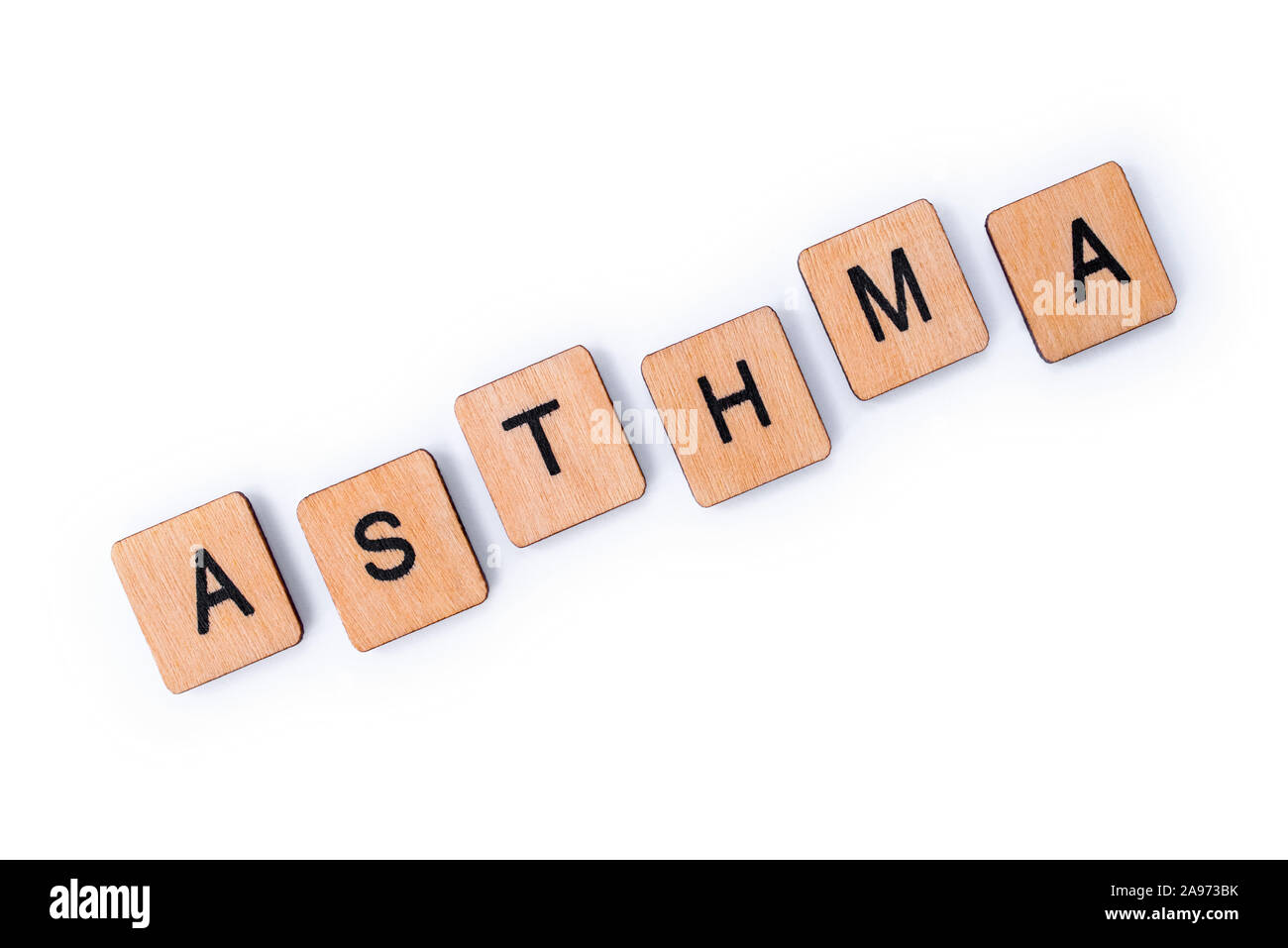 The word ASTHMA, spelt with wooden letter tiles over a white background ...