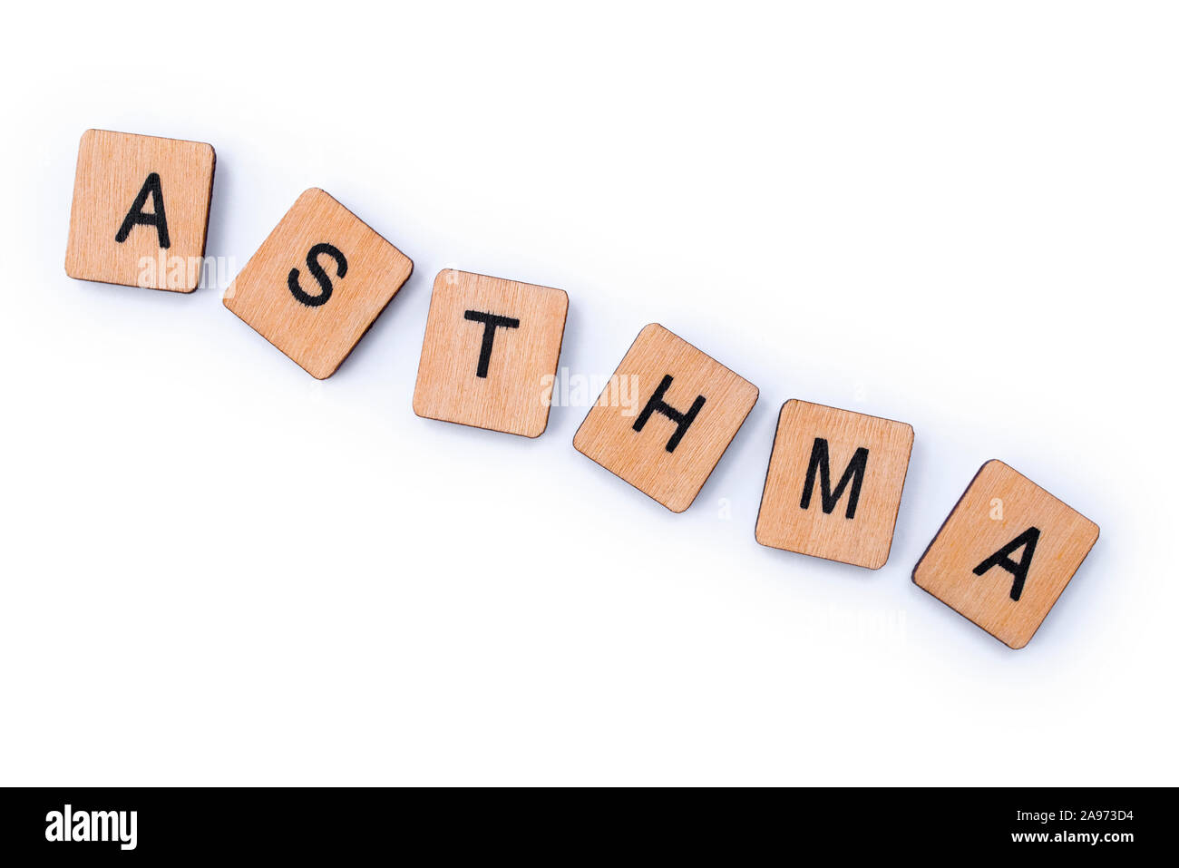 The word ASTHMA, spelt with wooden letter tiles over a white background ...