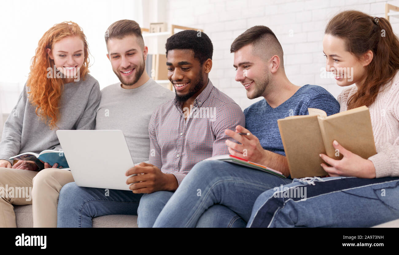 Learning concept. College students doing project, using laptop and ...