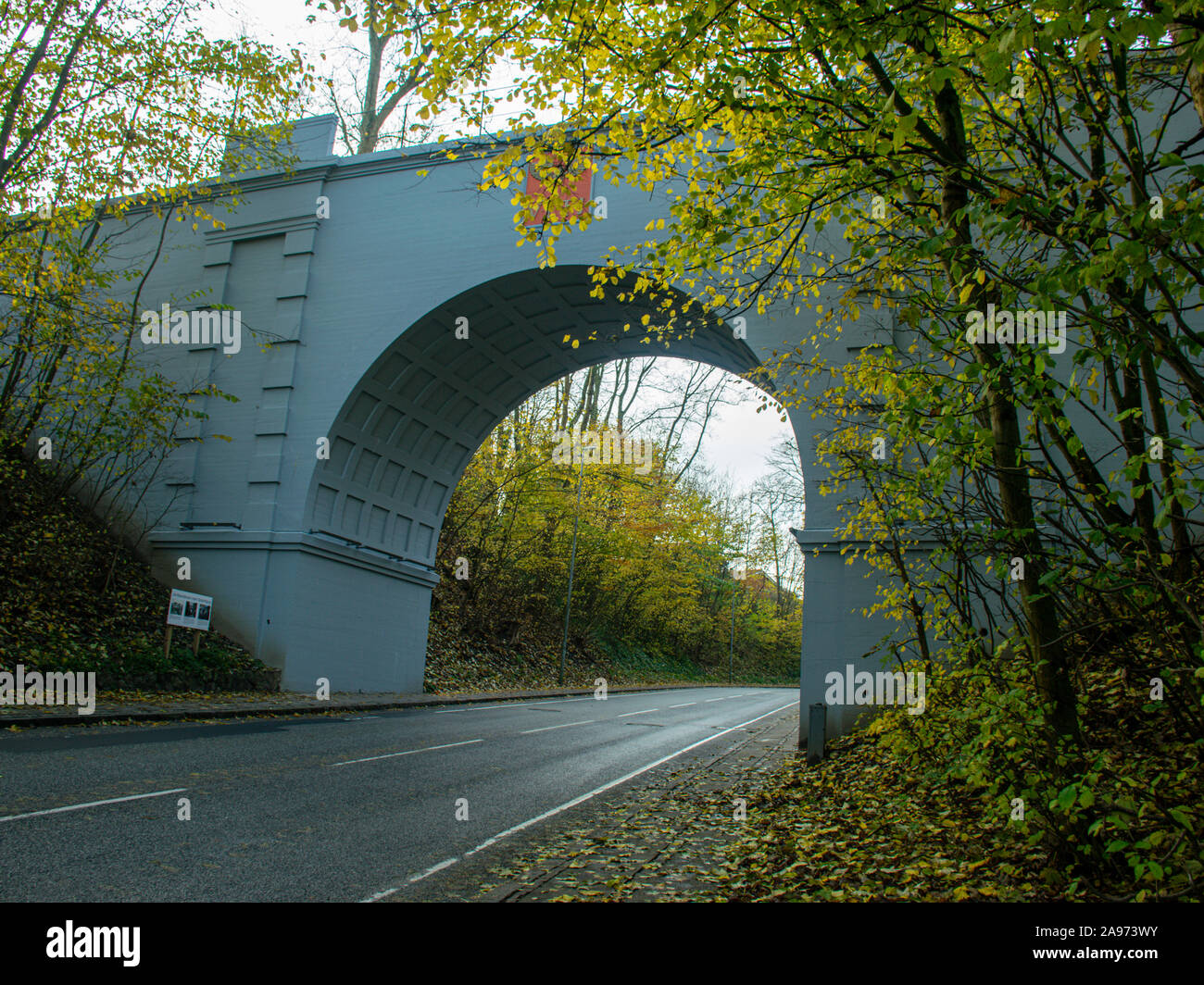 landscape with road under arched bridge Stock Photo - Alamy
