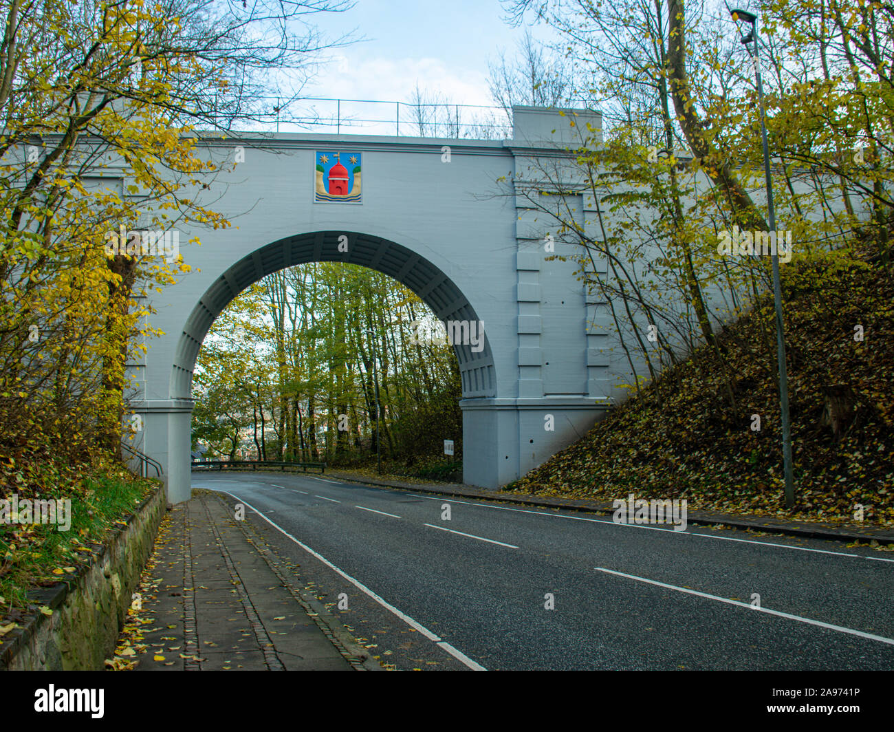 landscape with road under arched bridge Stock Photo - Alamy