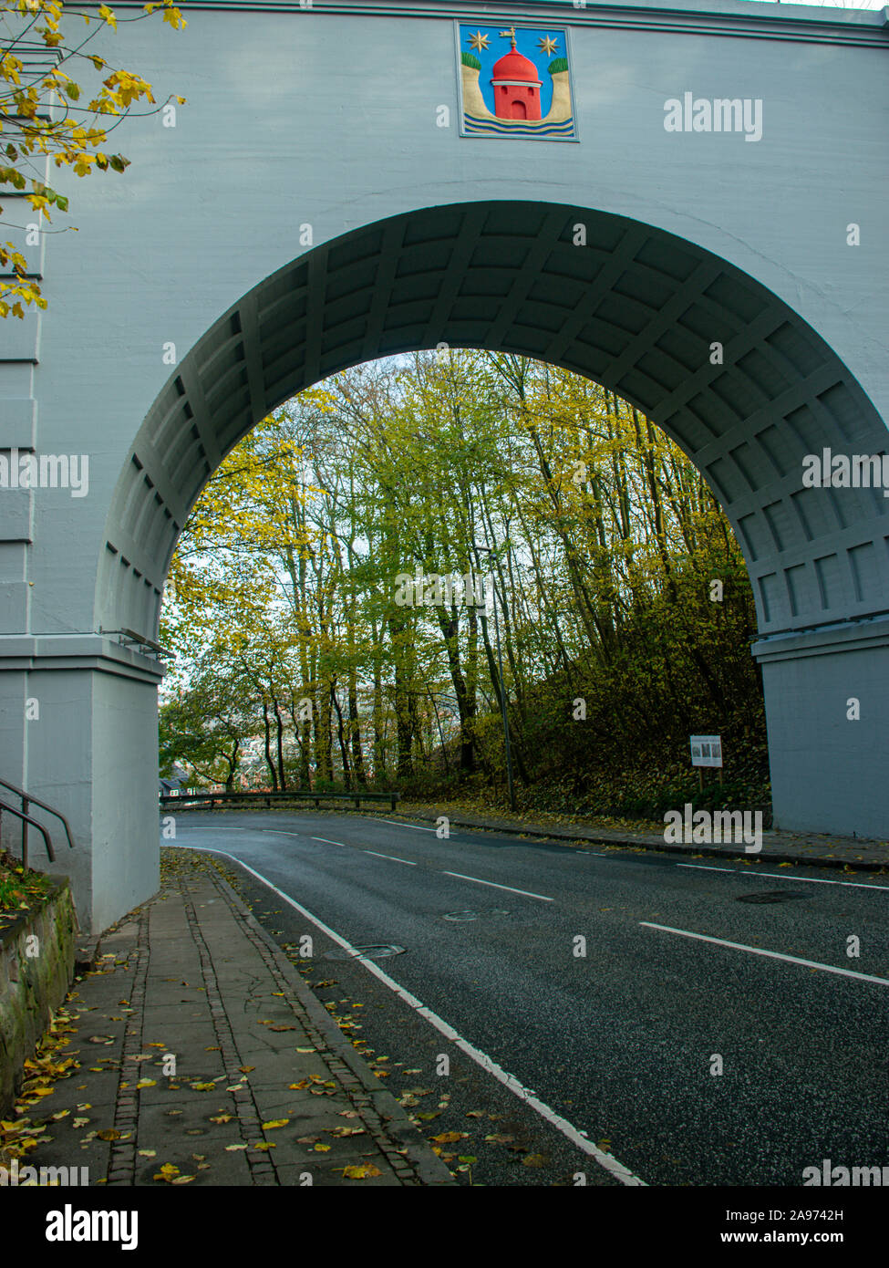 landscape with road under arched bridge Stock Photo - Alamy