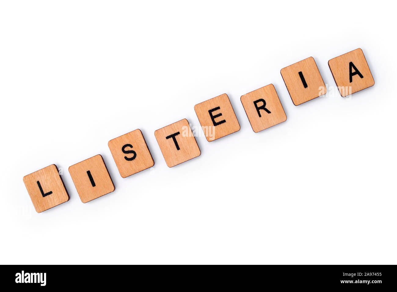 The word LISTERIA, spelt with wooden letter tiles, over a plain white ...