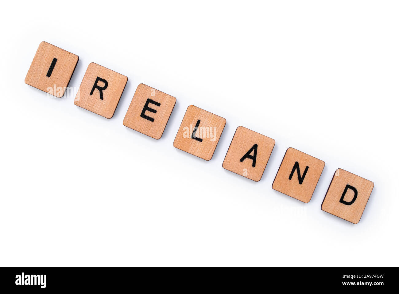 The word IRELAND, spelt with wooden letter tiles, over a plain white ...