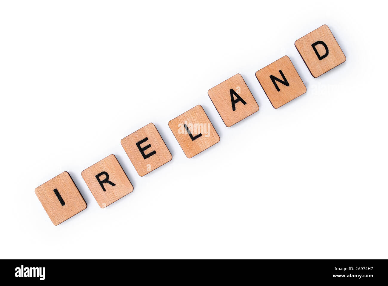 The word IRELAND, spelt with wooden letter tiles, over a plain white ...