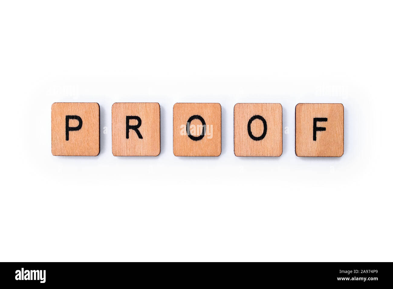 The word PROOF, spelt with wooden letter tiles over a plain white ...