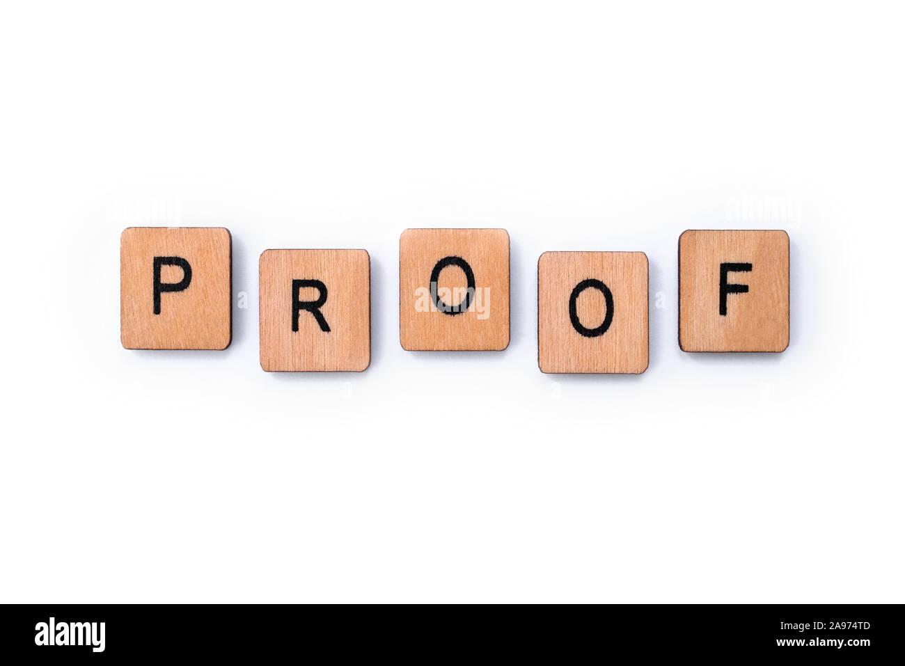 The word PROOF, spelt with wooden letter tiles over a plain white ...