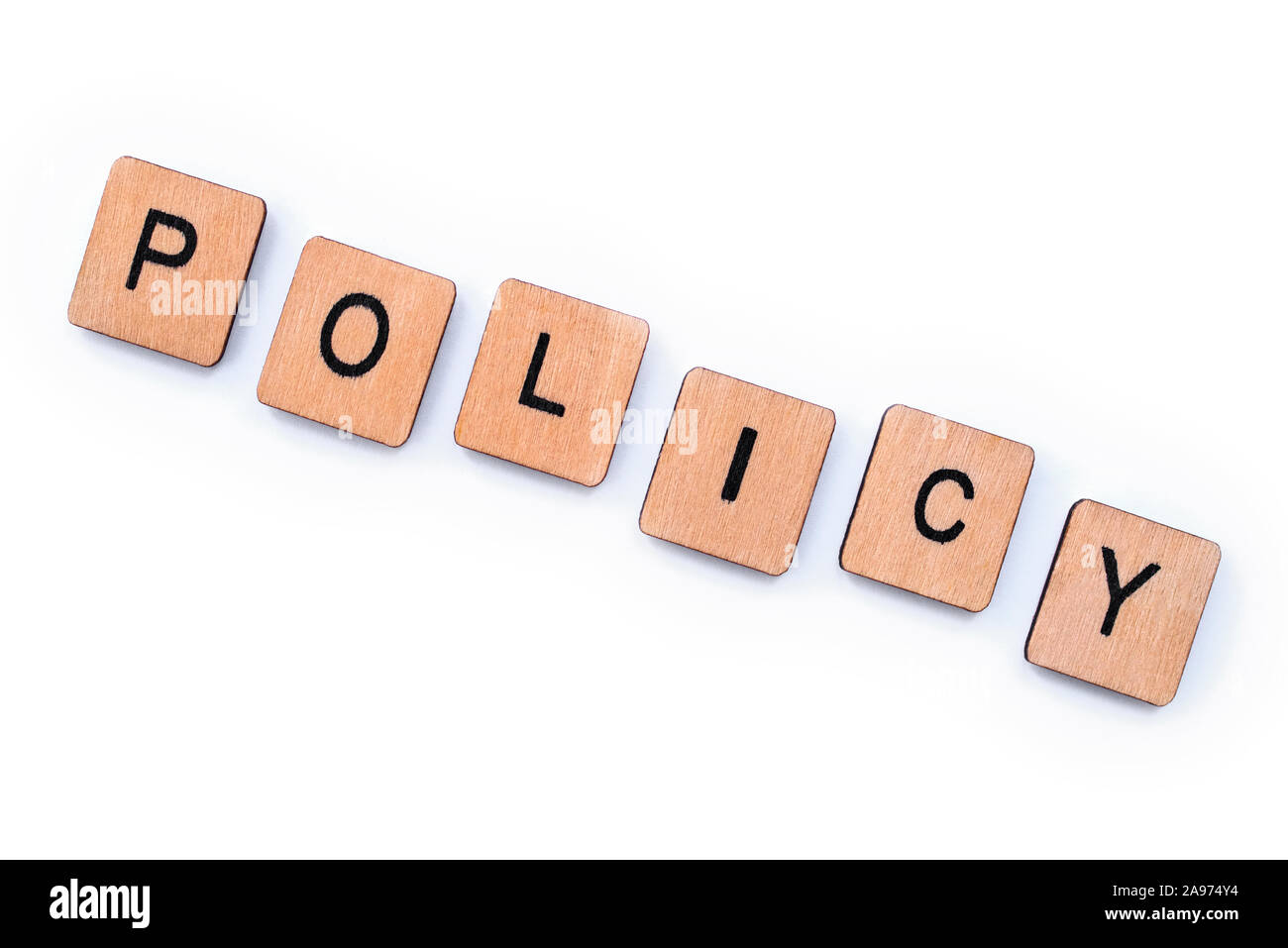 The word POLICY, spelt with wooden letter tiles over a plain white ...