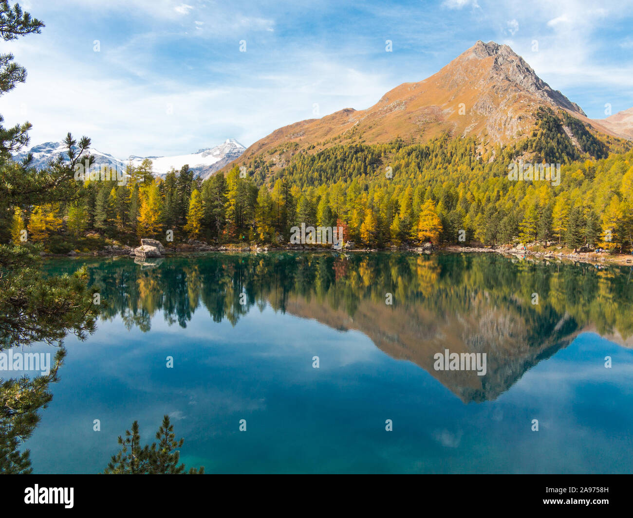 Autumn landscape, forests and alpine lake. Trekking in mountain in ...