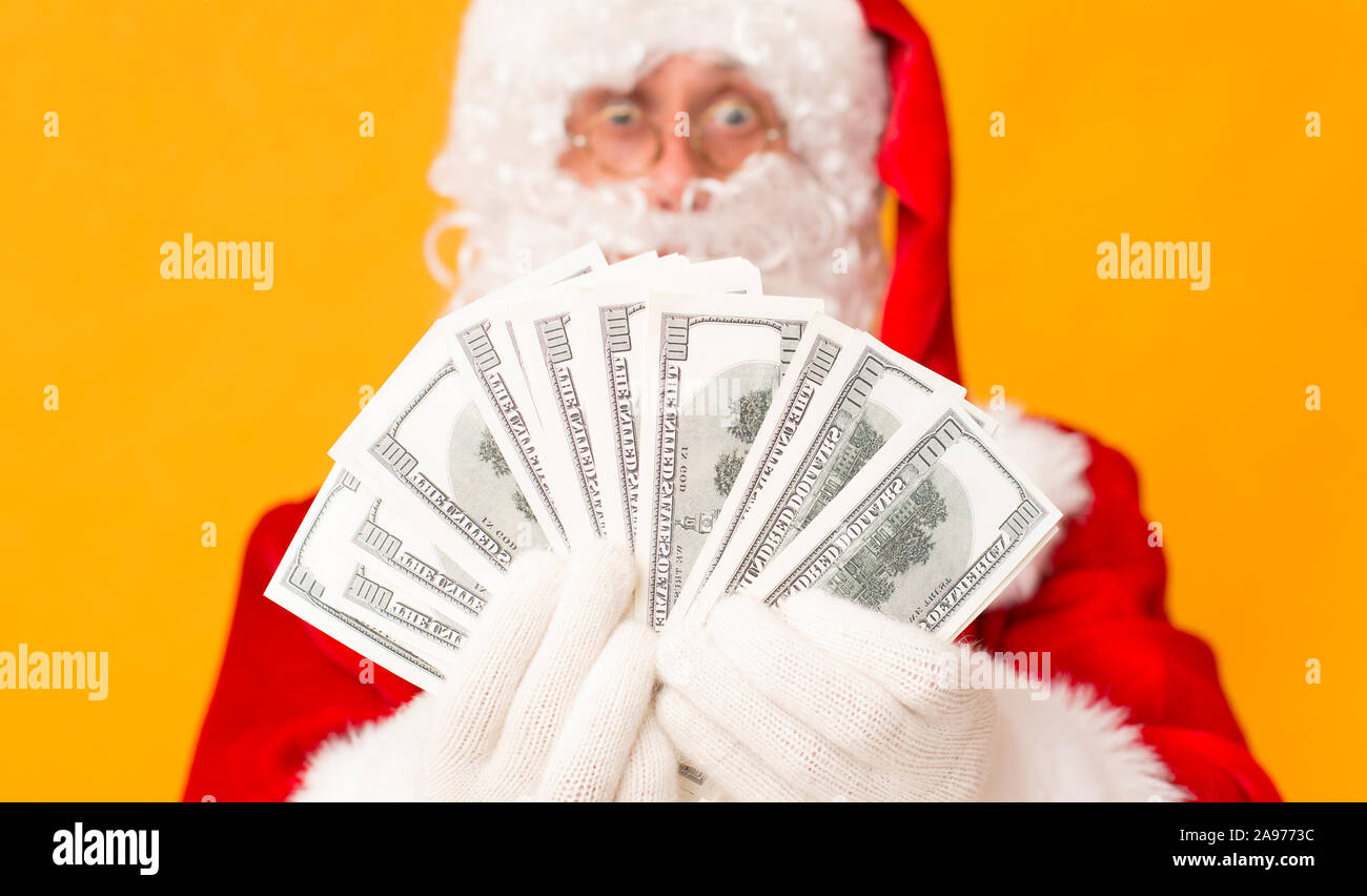 Santa Claus win a Christmas lottery and showing bunch of dollars on ...