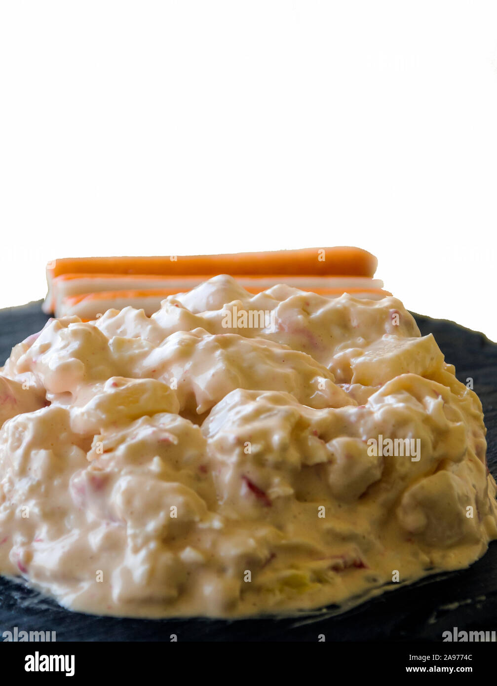 Russian salad surrounded by white background Stock Photo - Alamy