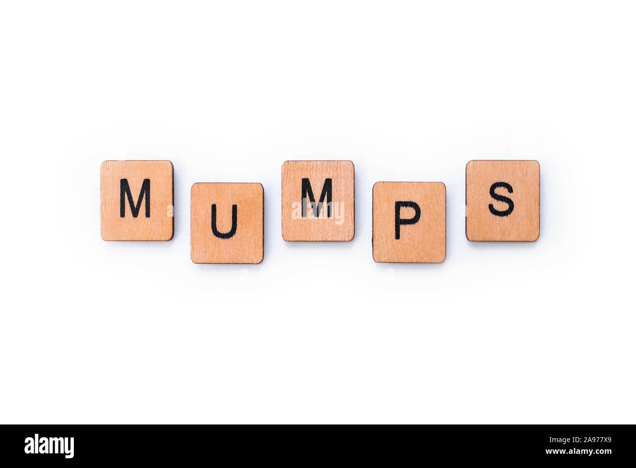The word MUMPS, spelt with wooden letter tiles over a white background ...