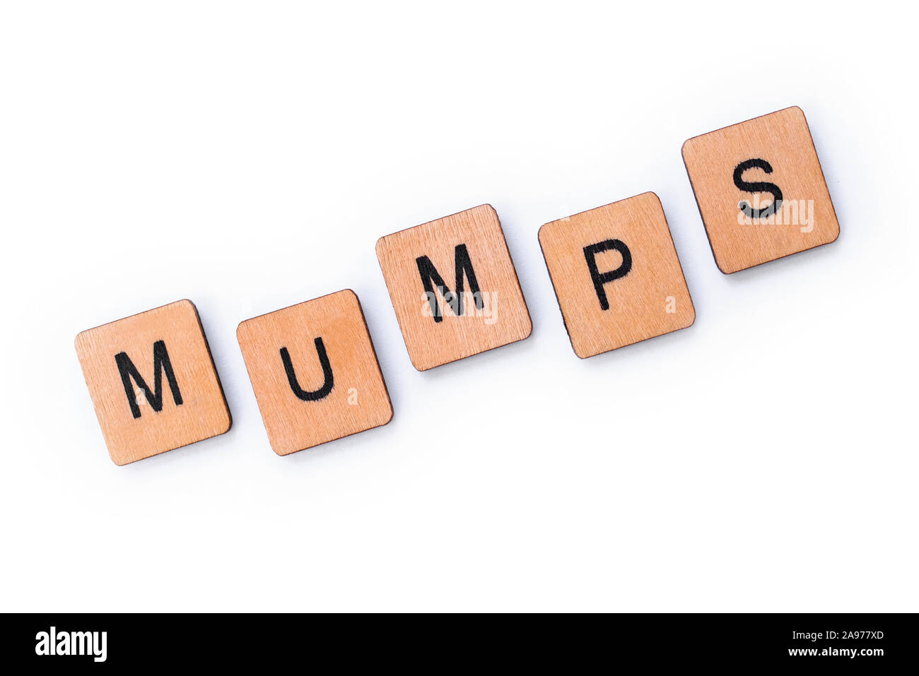 The word MUMPS, spelt with wooden letter tiles over a white background ...