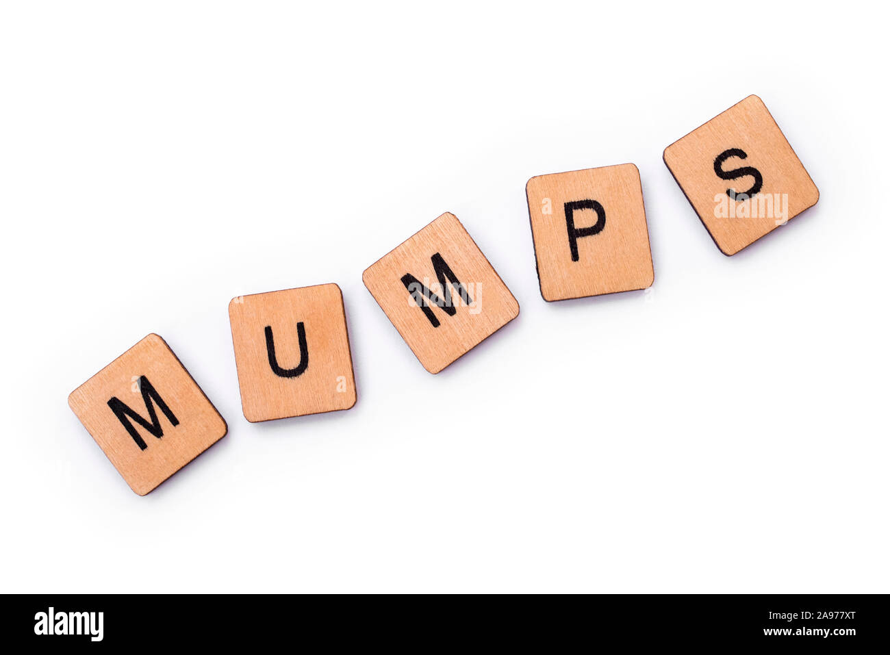 The word MUMPS, spelt with wooden letter tiles over a white background ...
