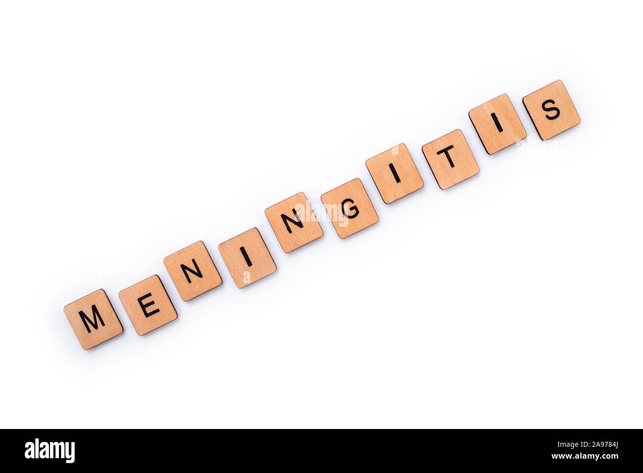 The word MENINGITIS, spelt with wooden letter tiles over a white ...