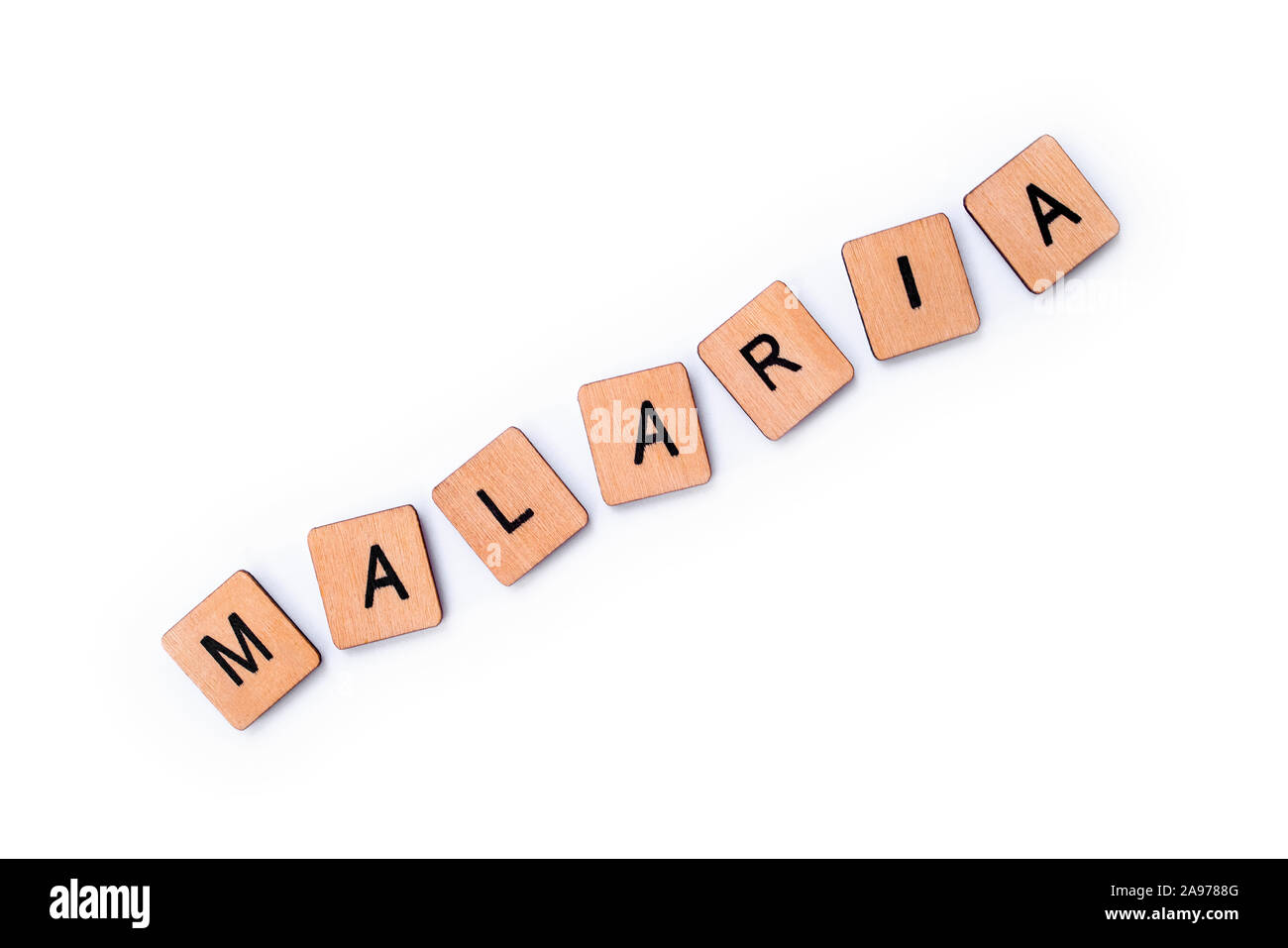 The word MALARIA, spelt with wooden letter tiles over a white ...