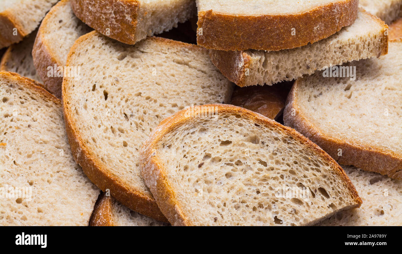 Brown bread pile detail. Halved slices as side dish portions. Staple ...