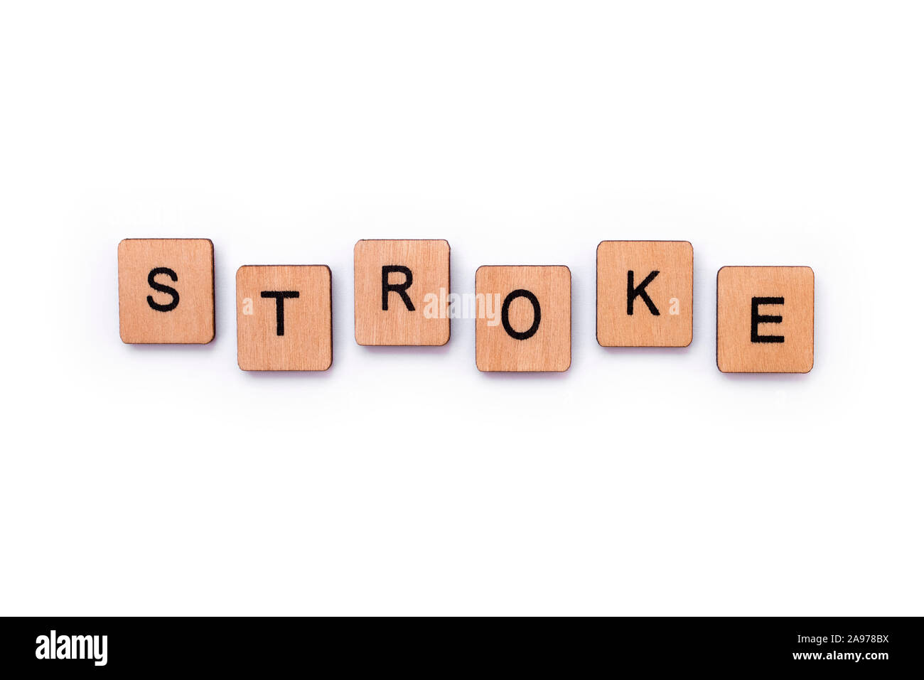 The word STROKE, spelt with wooden letter tiles over a white background ...