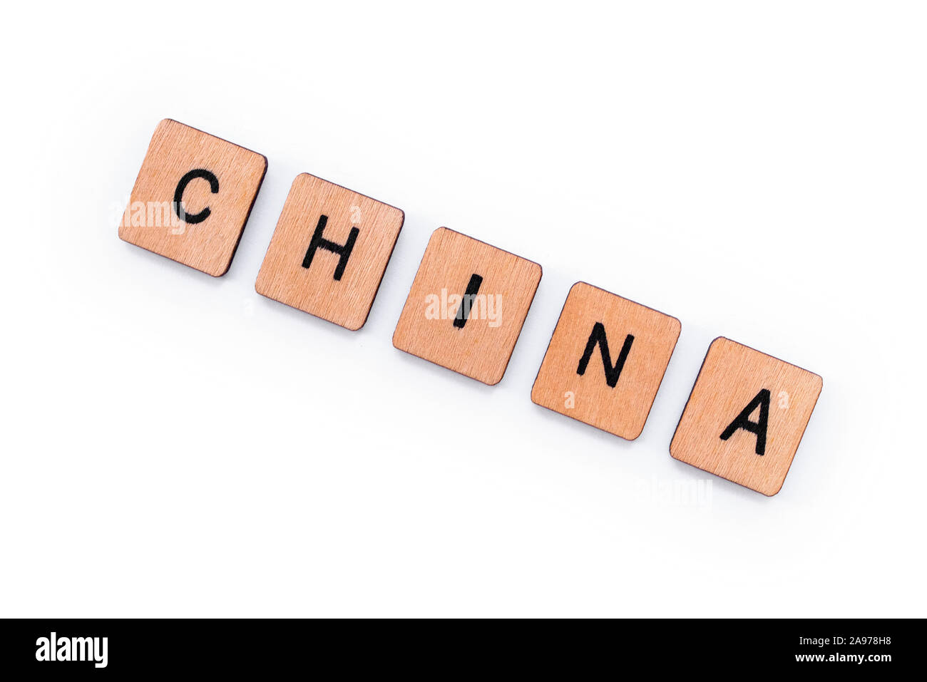 The word CHINA, spelt with wooden letter tiles over a white background ...