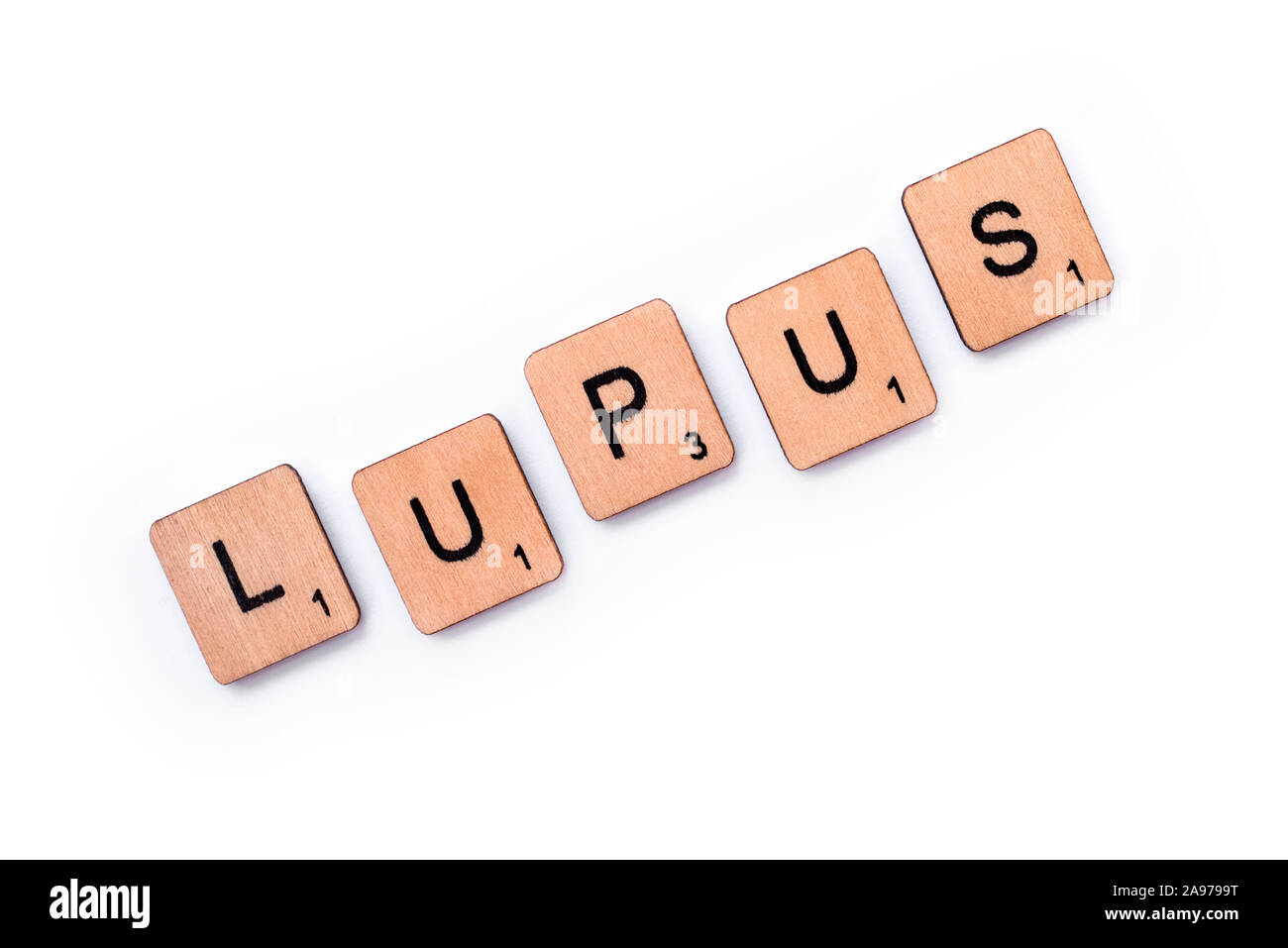 London, UK - June 16th 2019: LUPUS, spelt with wooden letter tiles over ...