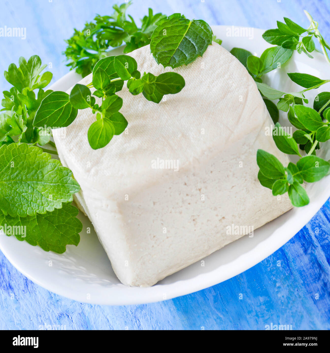 Tofu bean curd and herbs Stock Photo - Alamy