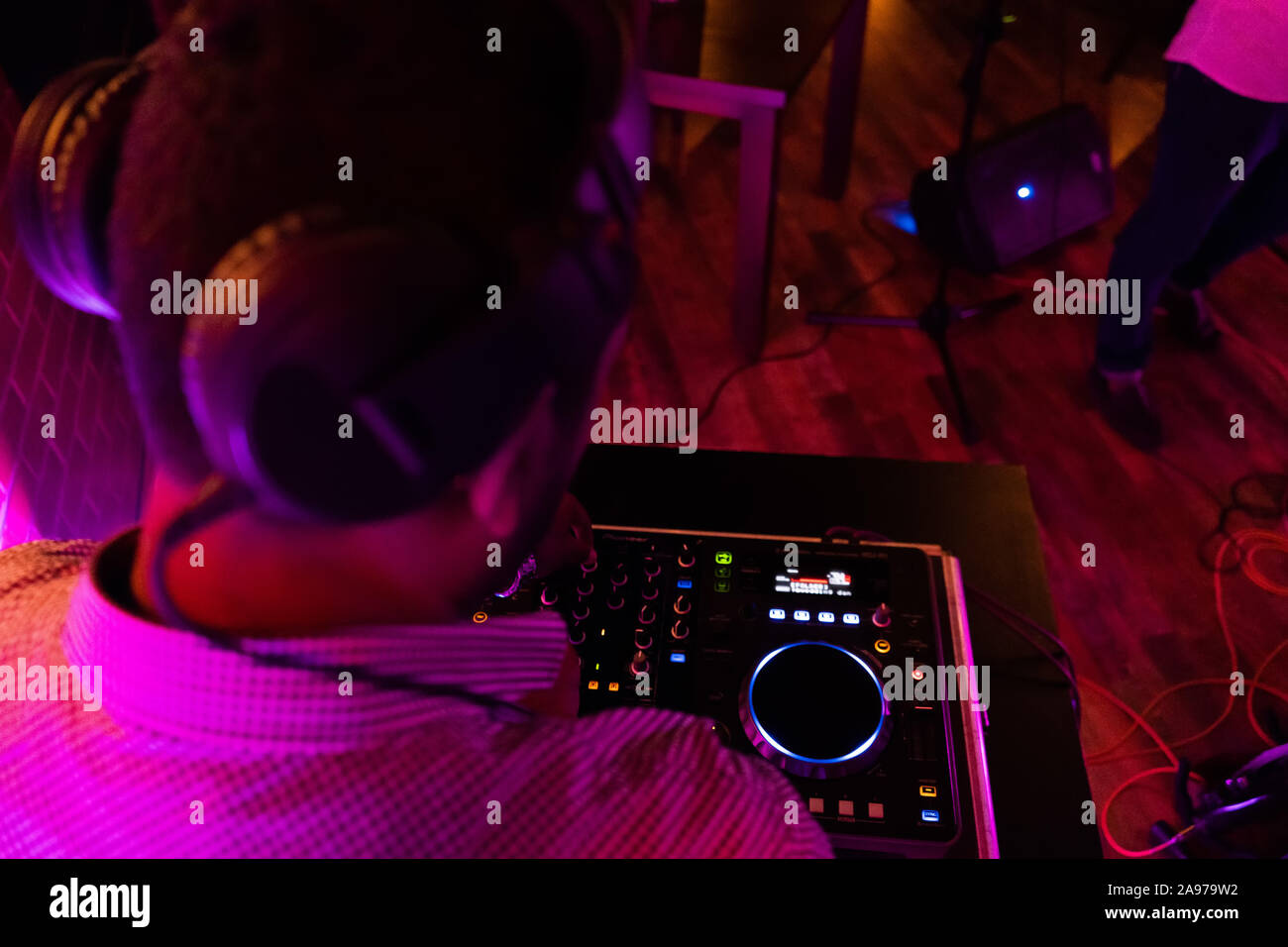 the DJ behind work in night club Stock Photo - Alamy