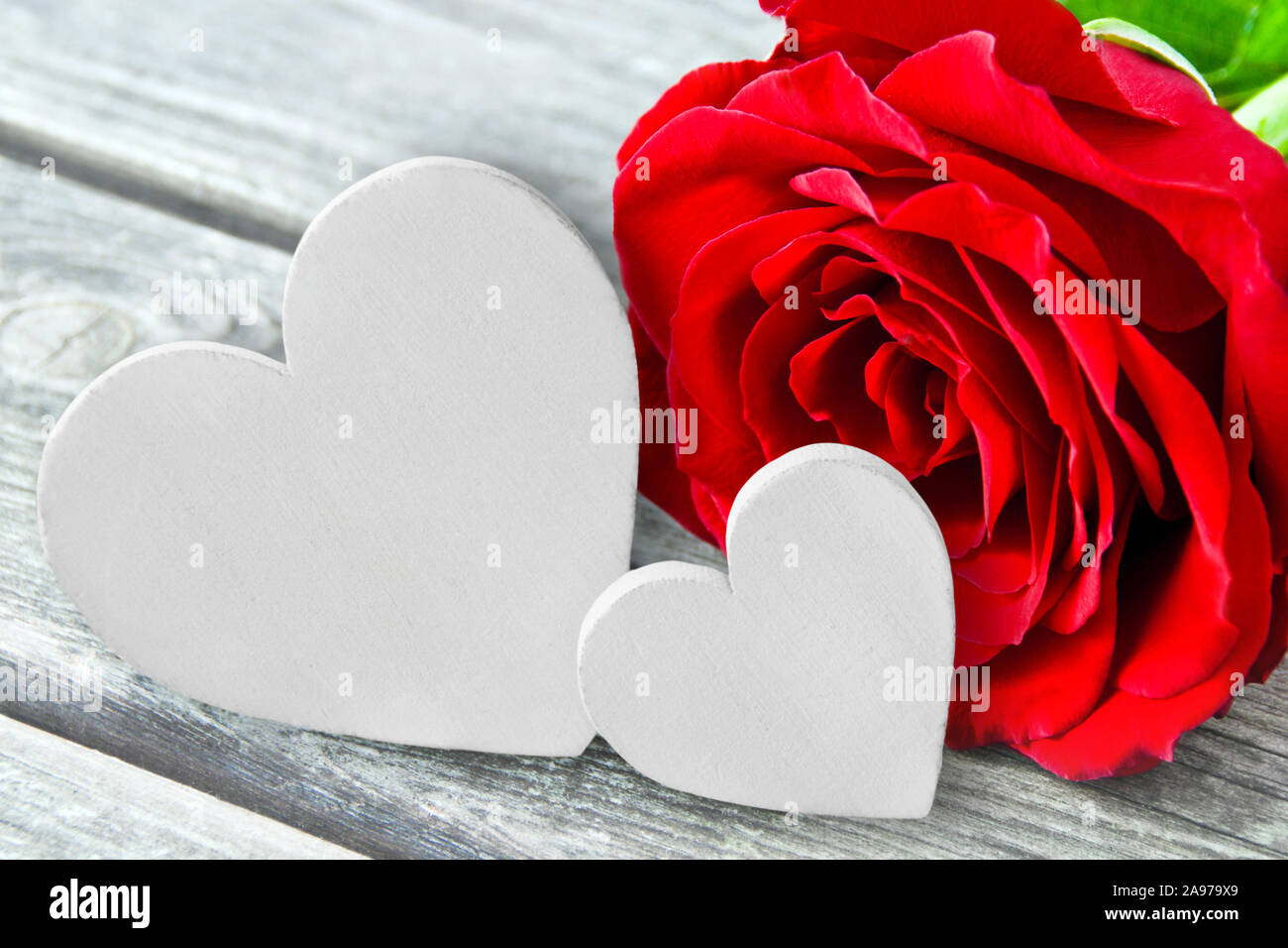 Red rose and two hearts Stock Photo - Alamy