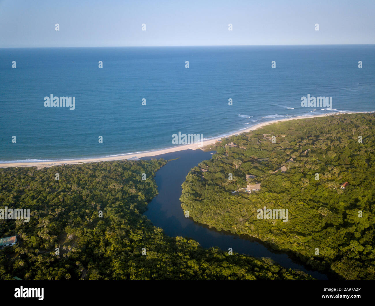 Drone picture of a lagoon in a coastal forest and the Indian ocean on ...