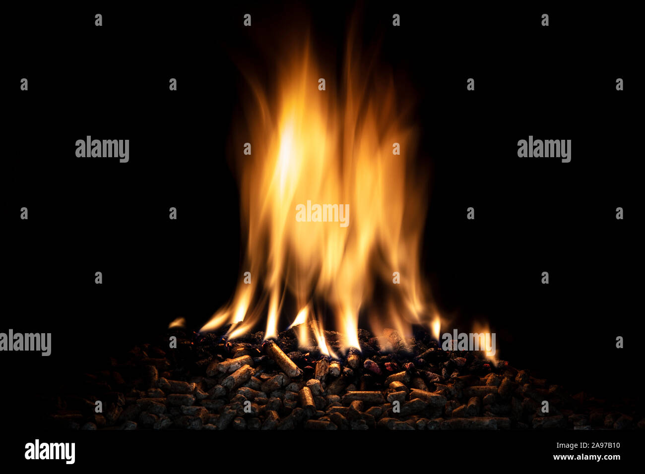 wood pellet burning with a live flame. ecological fuel concept Stock ...