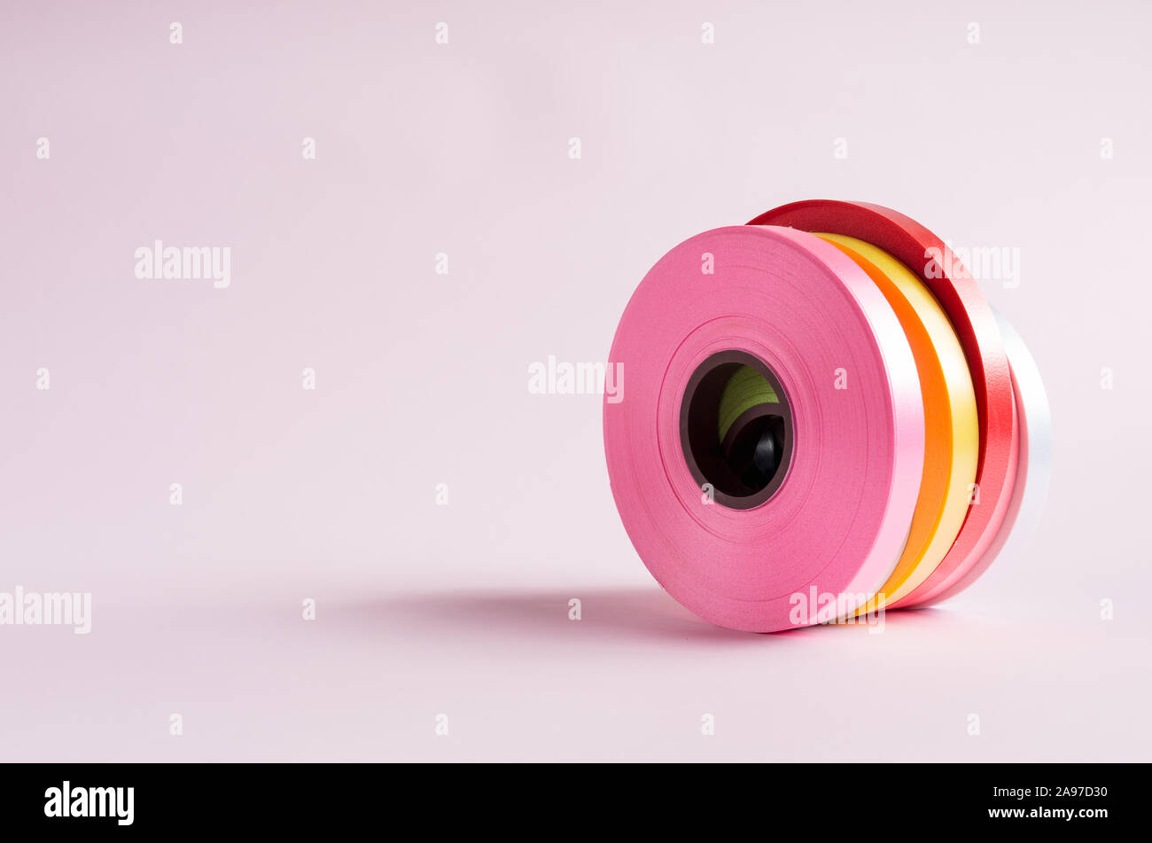 Pink ribbon roll hi-res stock photography and images - Alamy