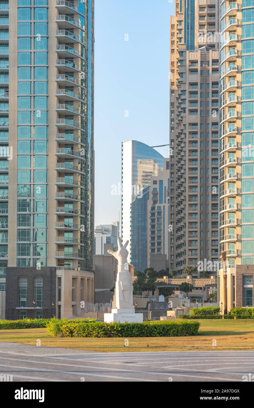The hand statue at the Burj Park in downtown Dubai during sunrise Stock ...