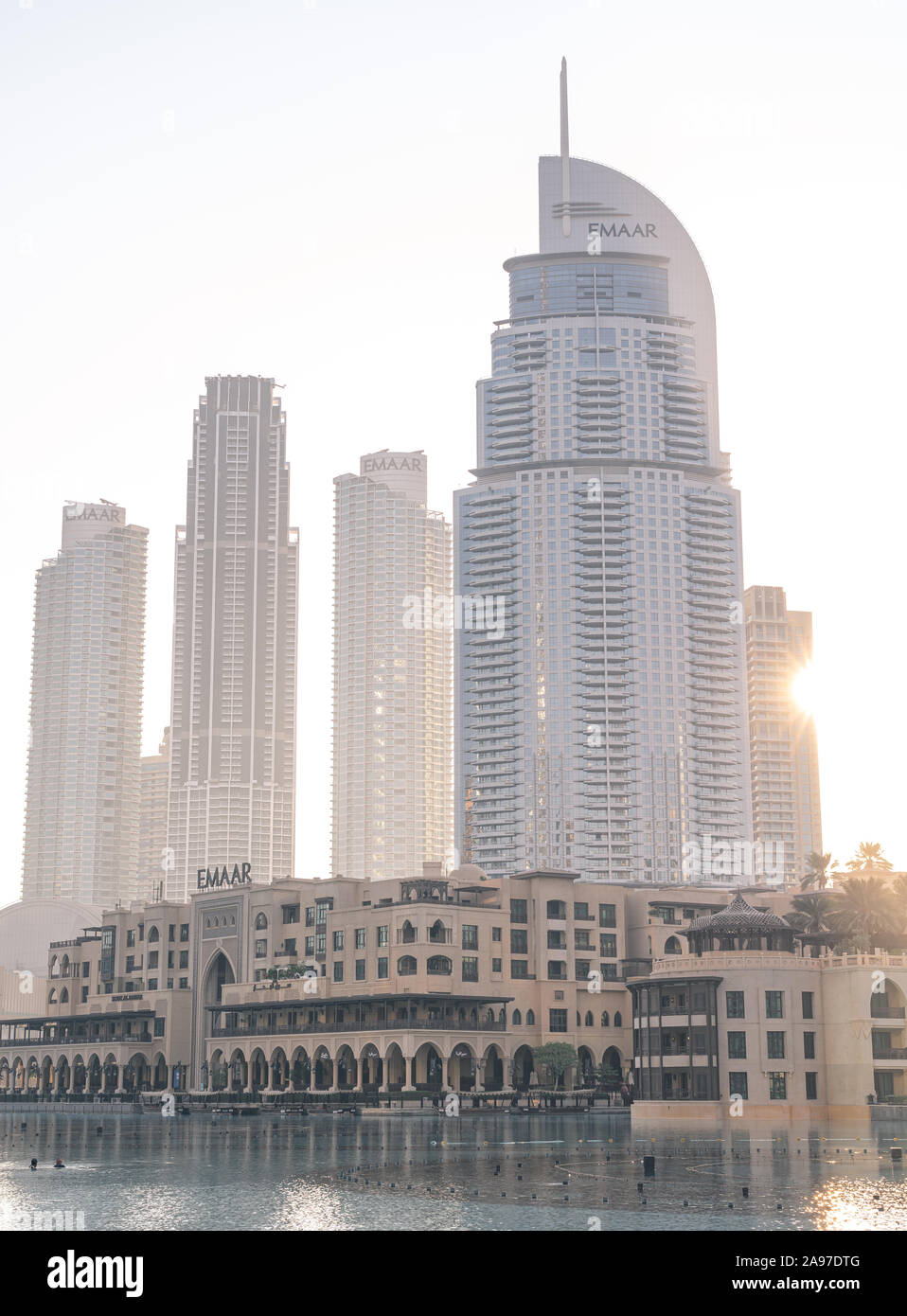 Sunrising behind the high-rise buildings near the Dubai Mall in ...