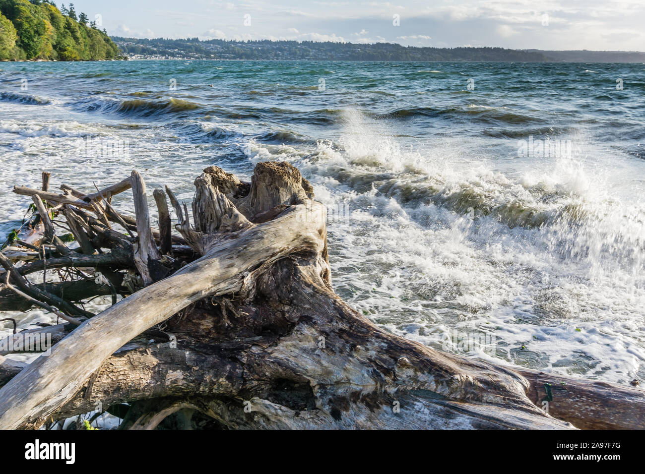 Wave from the Puget Sound hit rocks on the shoreline in Des Moines ...