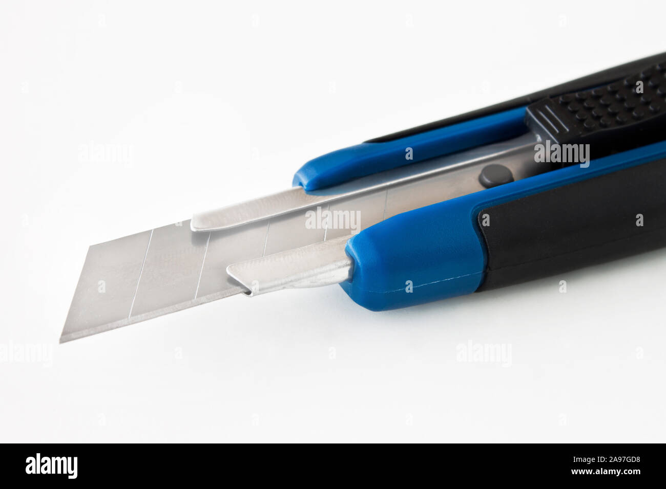 Cutter knife against white background Stock Photo - Alamy