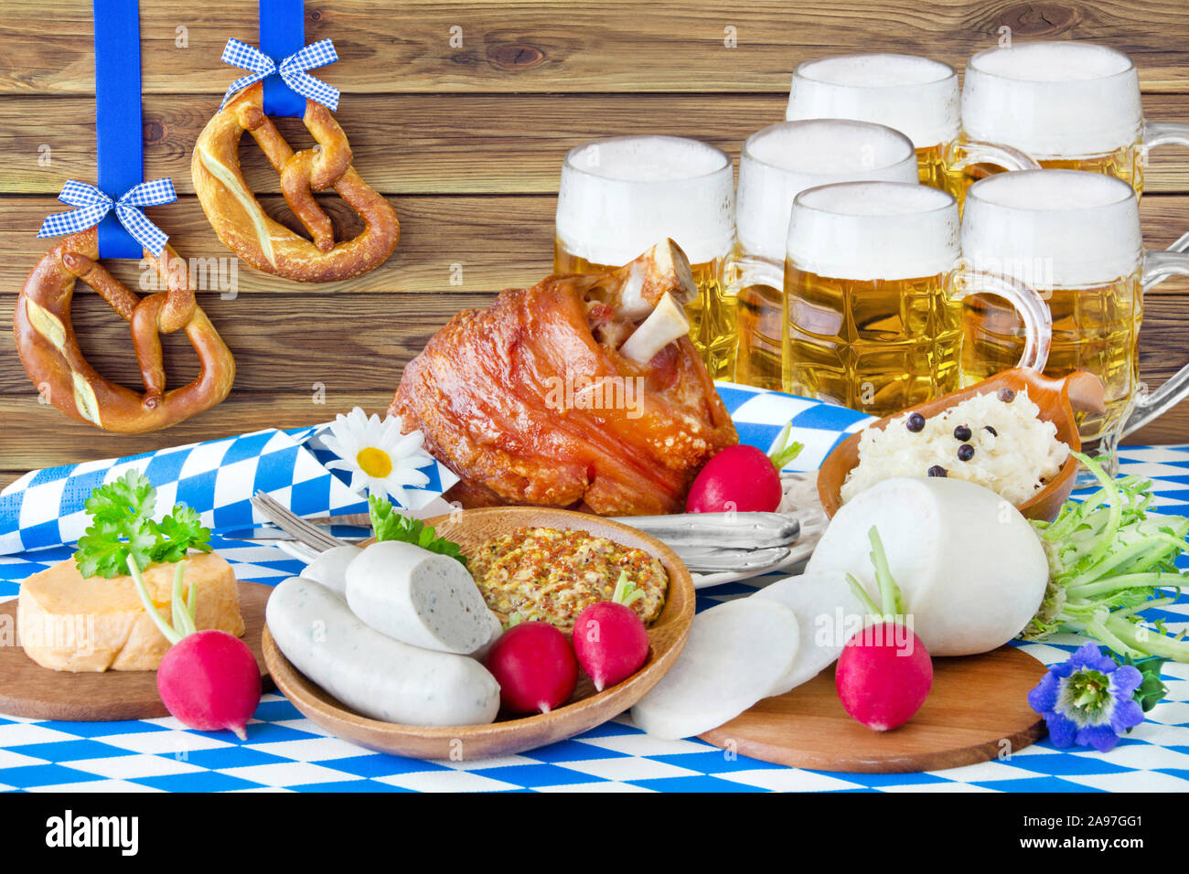 German Bavarian beer and pretzel with knuckle of pork Stock Photo - Alamy