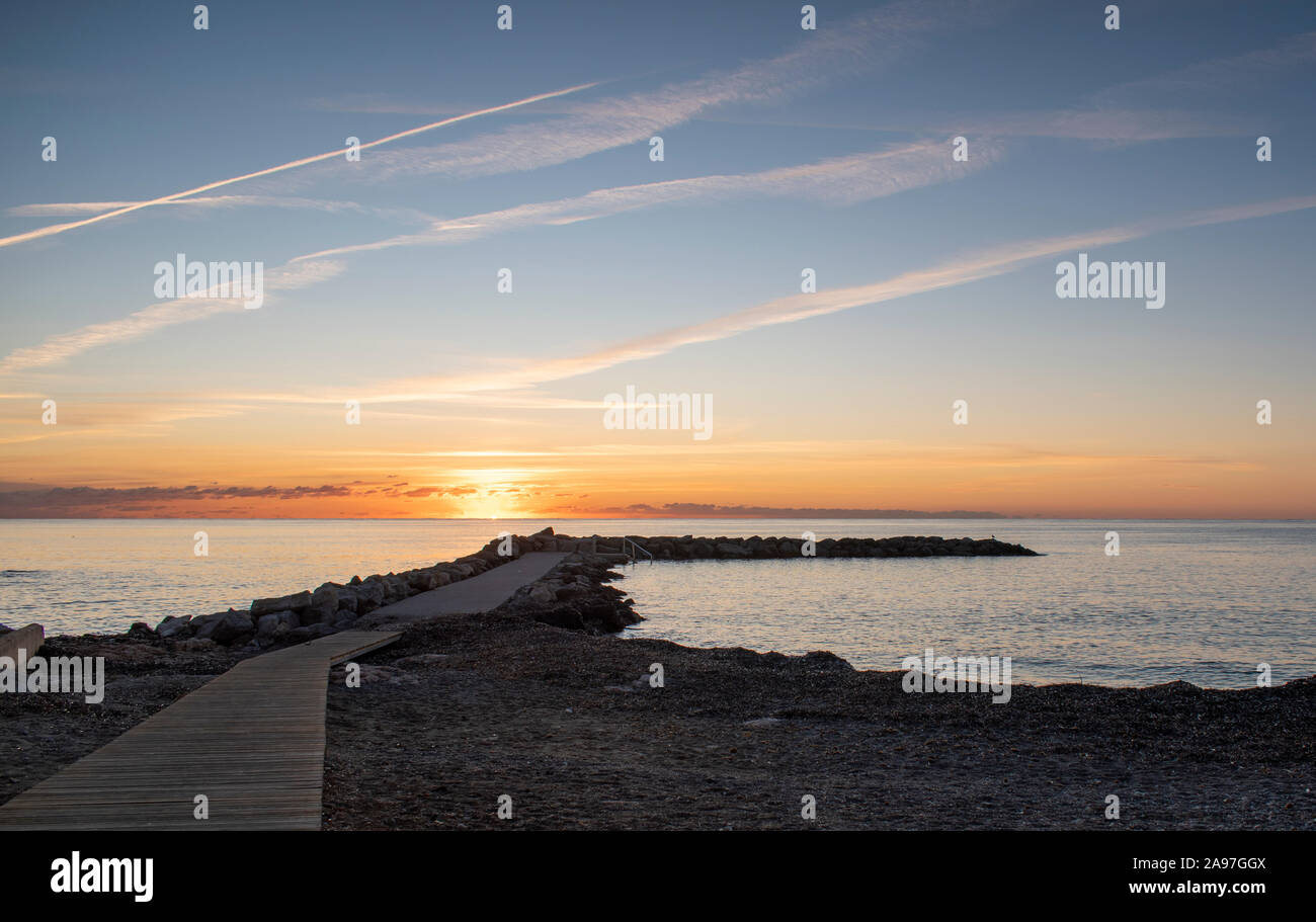 Sunrise in Cala Bona Majorca with the sun just appearing over the ...
