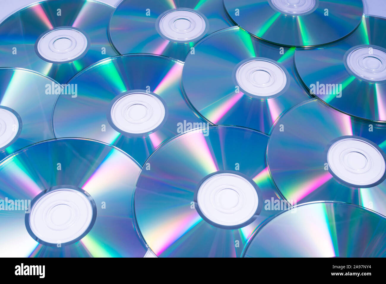 A shot of shiny Compact Discs or CDs, over a white background Stock ...