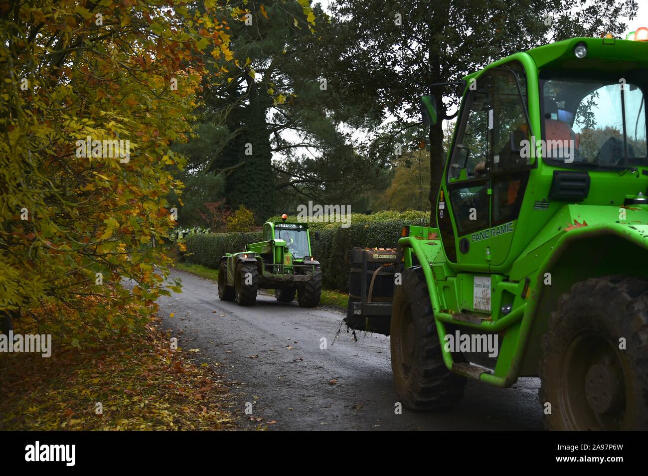 Tree nursery worker using heavy lifting equipment Stock Photo - Alamy