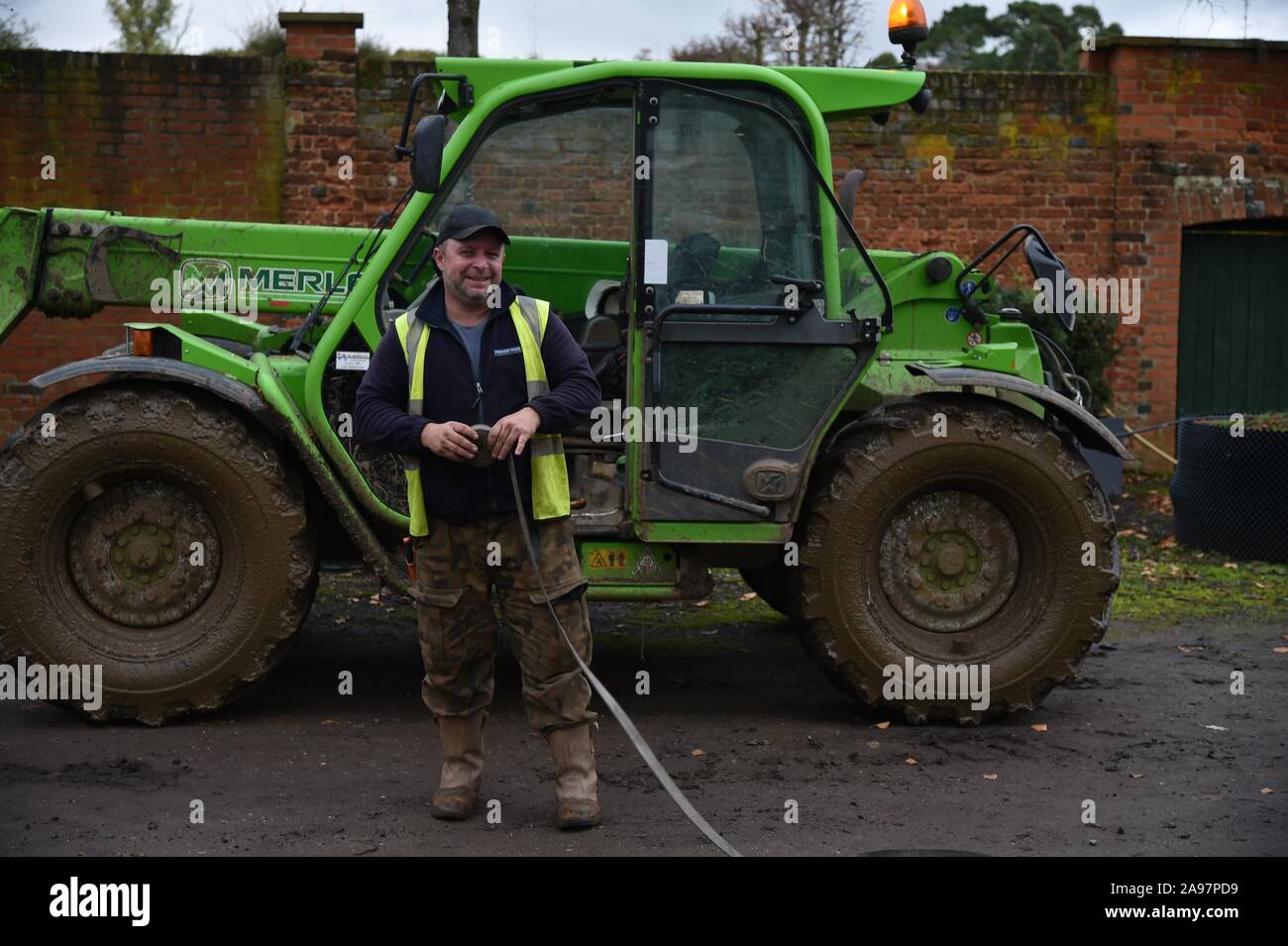 Tree nursery worker using heavy lifting equipment Stock Photo - Alamy
