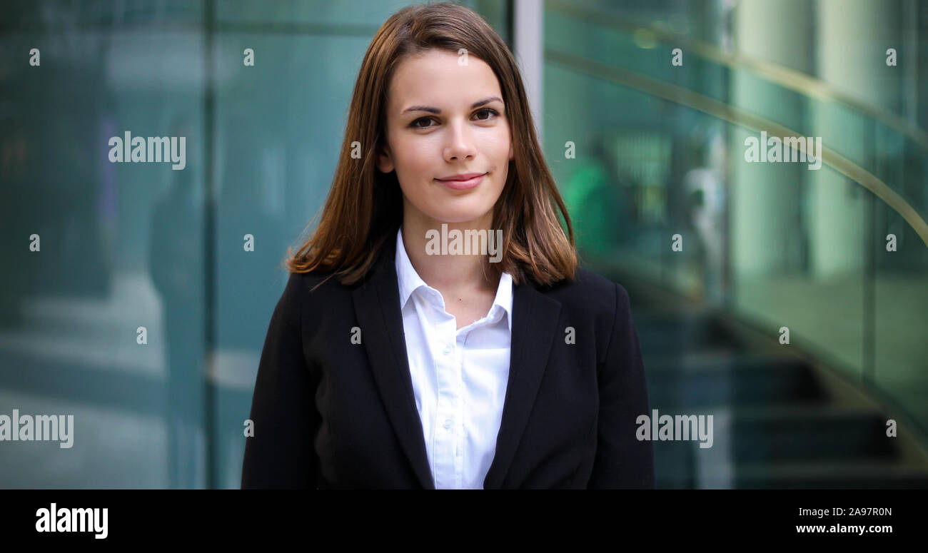 Confident young female manager outdoor in a modern urban setting Stock ...