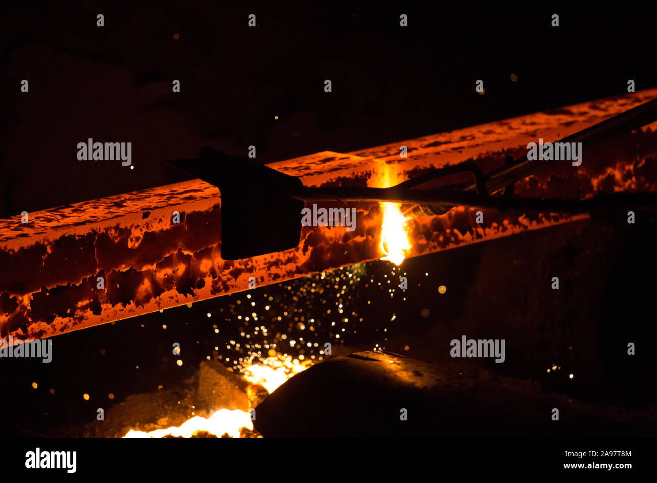 Gas cutting of the hot metal in steel plant at Demra, Dhaka, Bangladesh ...