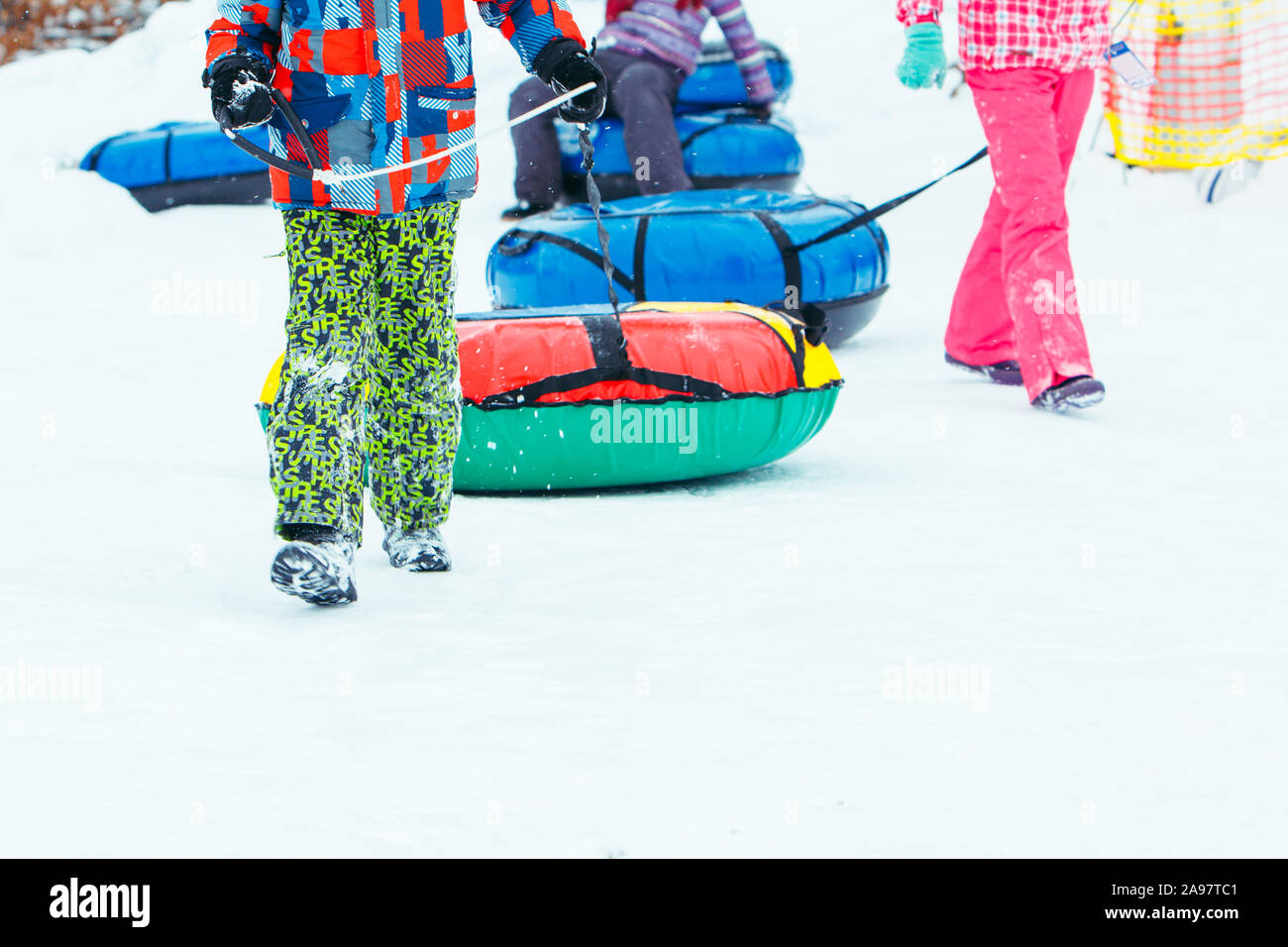 Boy pushing sled hi-res stock photography and images - Alamy