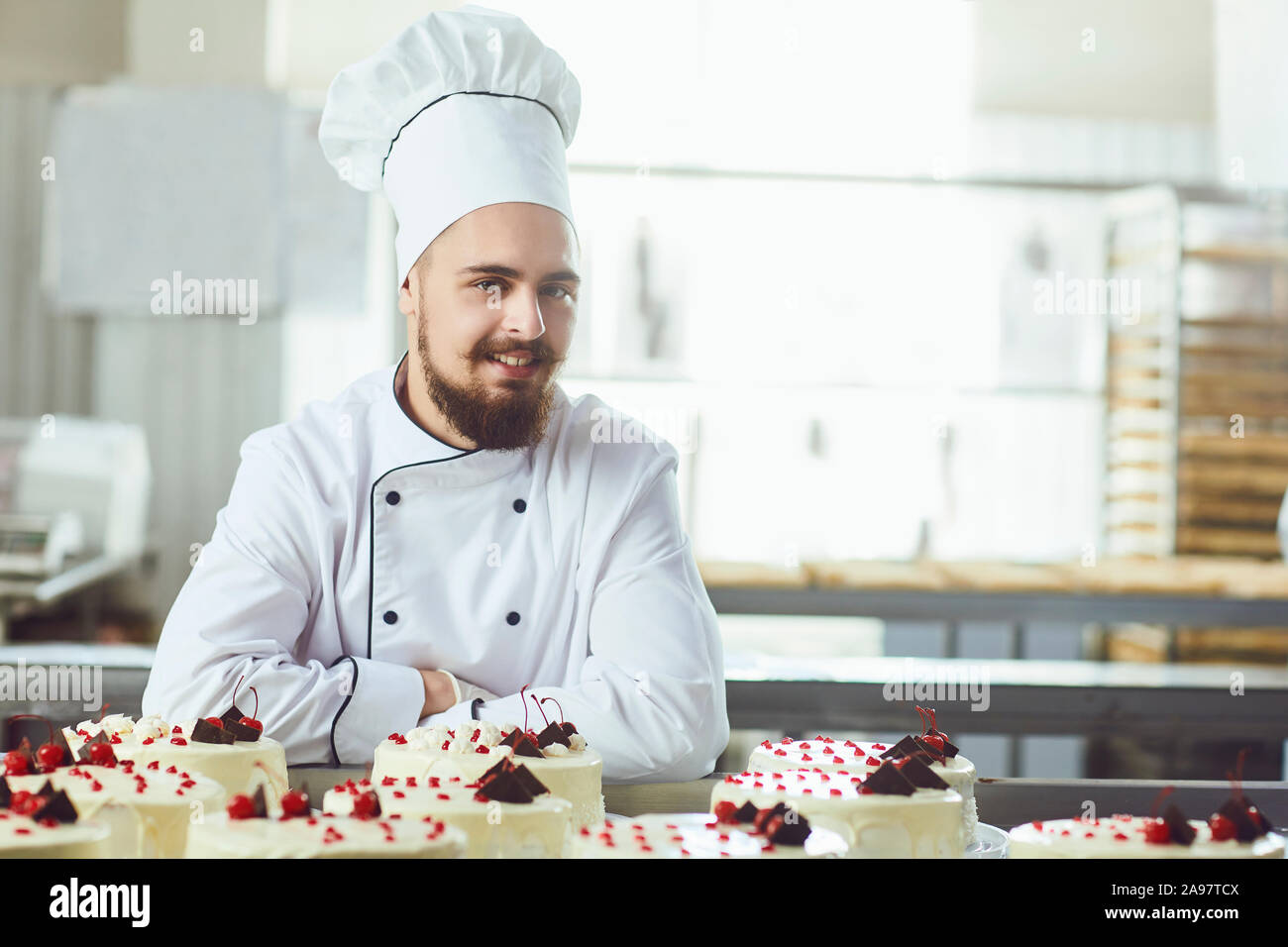 Pastry man smiling in a pastry shop Stock Photo - Alamy
