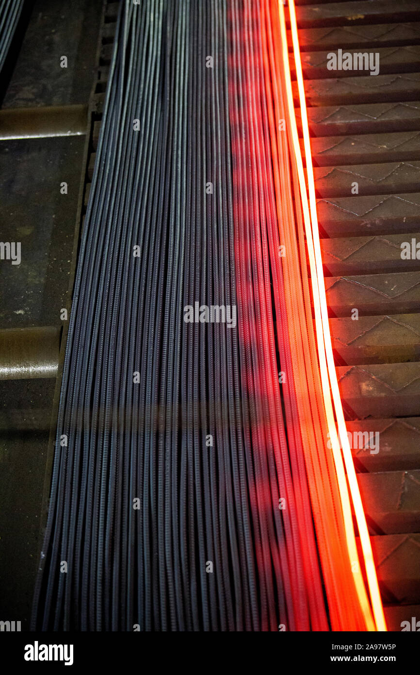 Heated metal pig gets squeezed and drilled at special metal forging ...