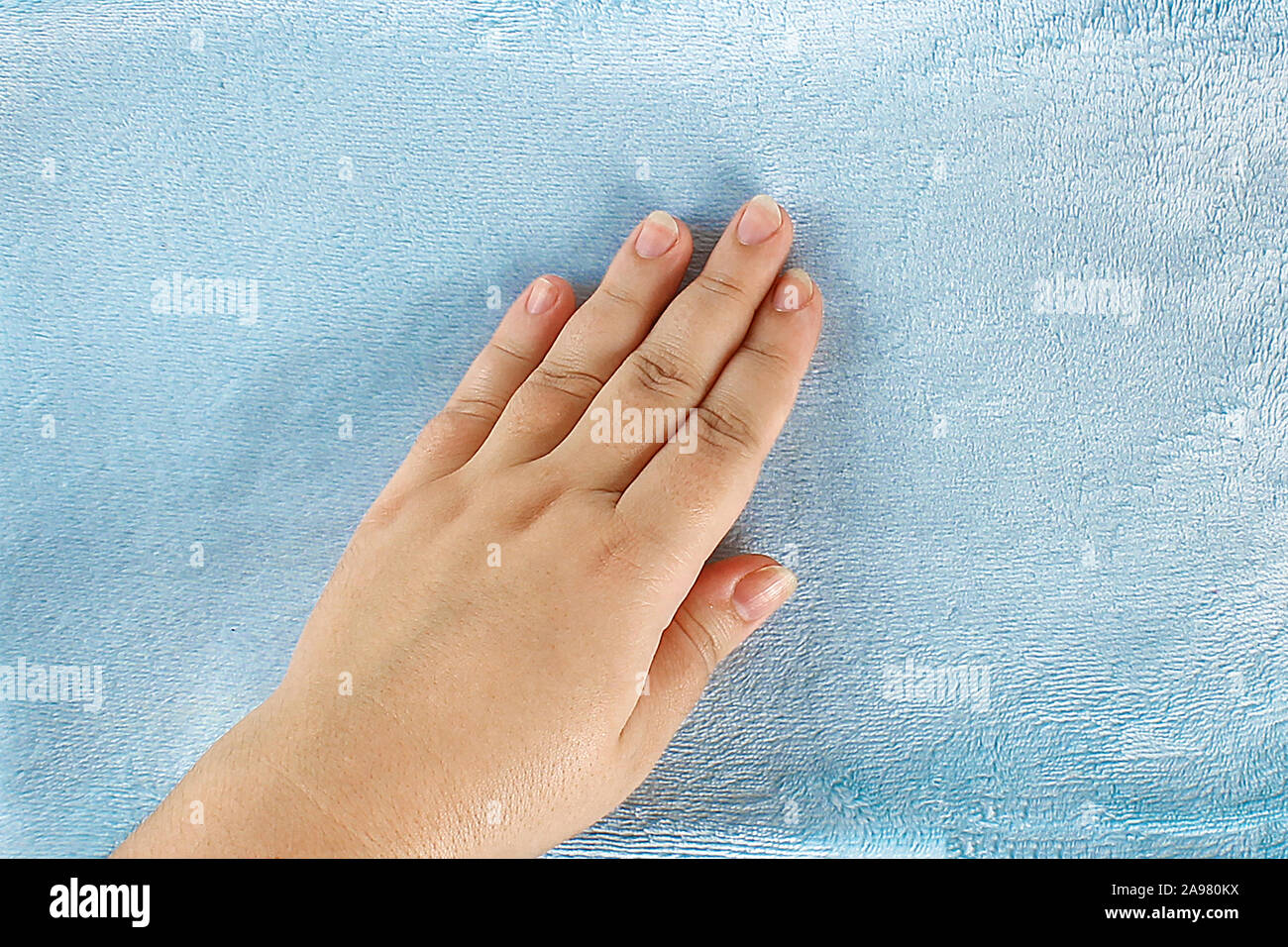 Hand touches the fabric. The concept of touch, tactility, feelings ...