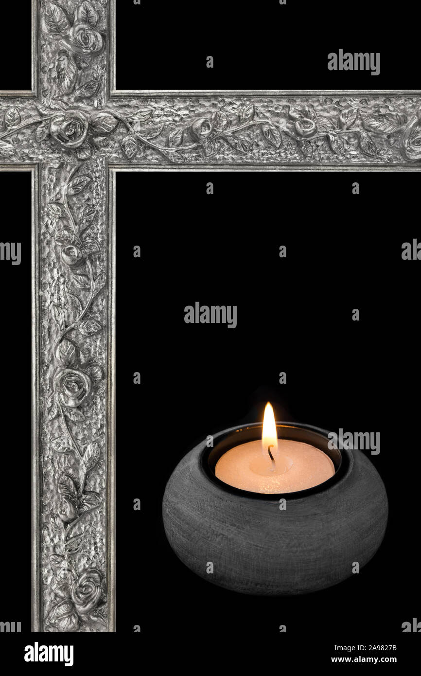 Candle, cross and black background Stock Photo - Alamy