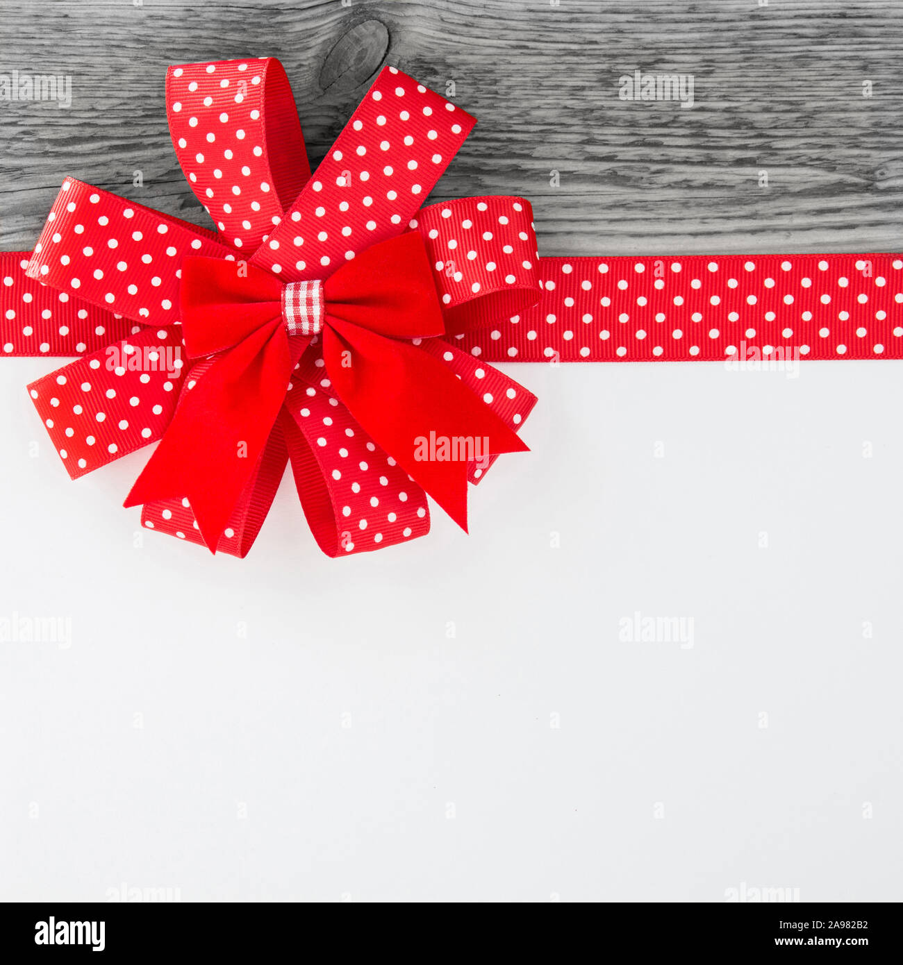 Christmas decoration with red bow Stock Photo - Alamy