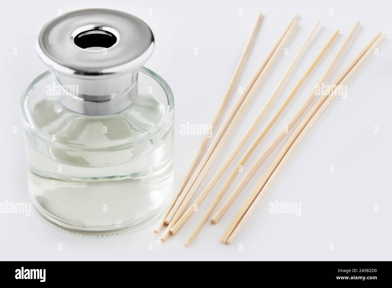 Essential oil and wooden sticks Stock Photo - Alamy