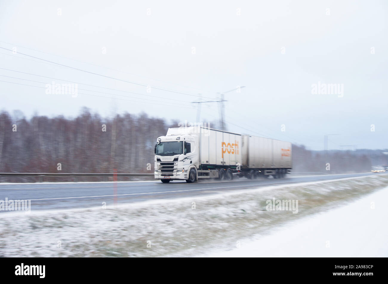 Finnish Post truck speeding at slippery and icy highway Stock Photo - Alamy